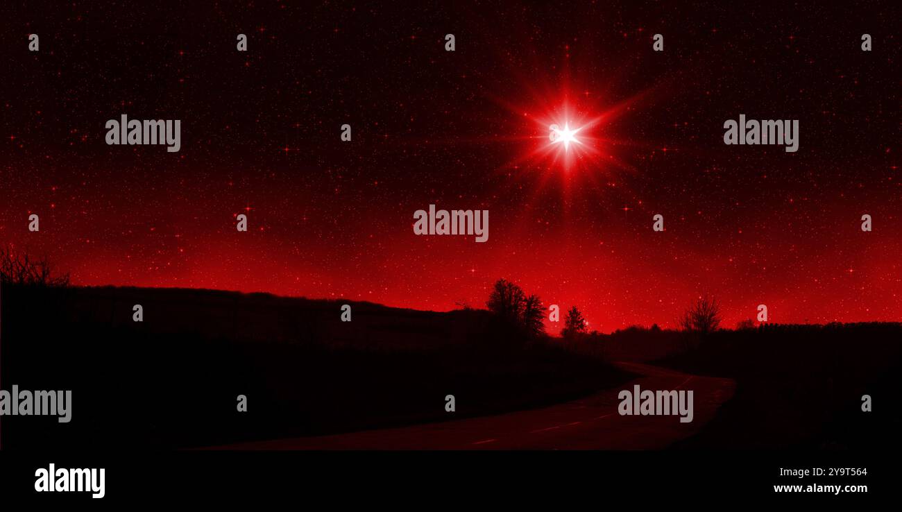 Bright red star shines over the road at night. Birth of Jesus concept ...
