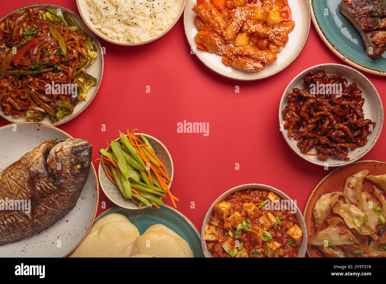 Assorted traditional chinese dishes top view on red background: kung ...