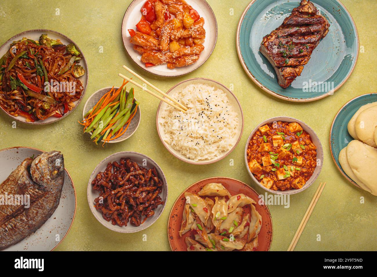 Assorted traditional chinese dishes top view on green background: kung ...