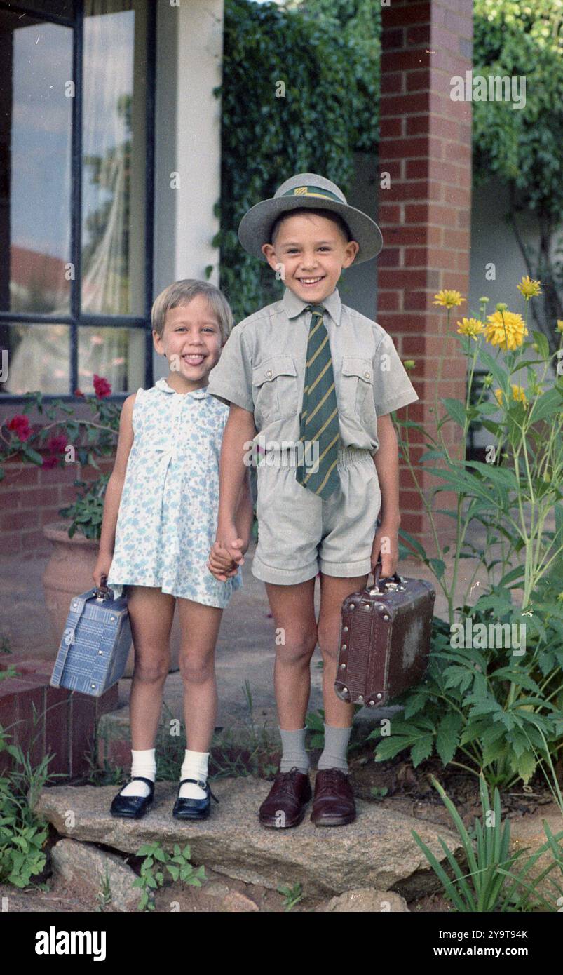 1970s, historical, little boy with his younger sister holdings pose for ...