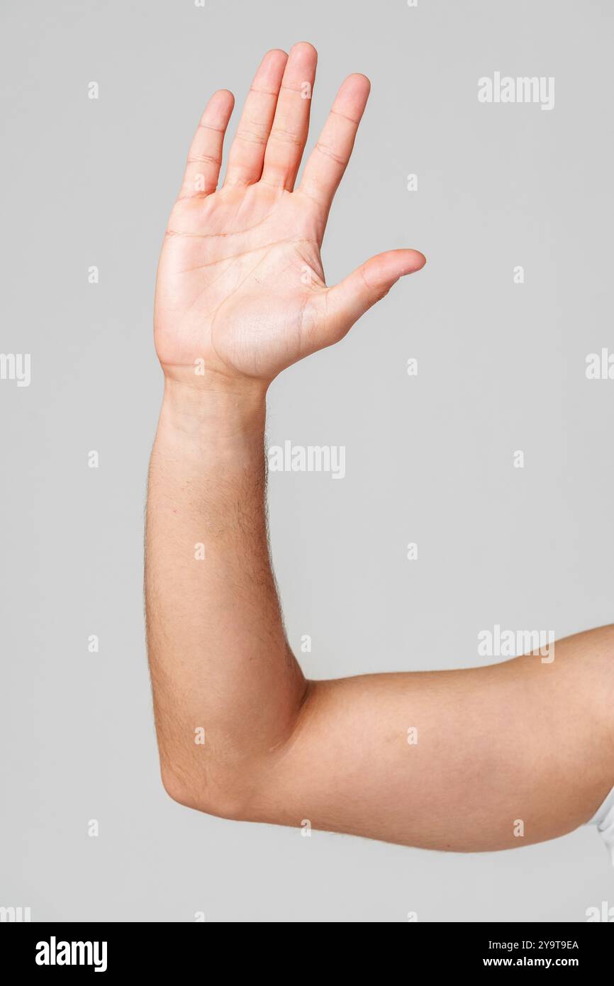 A person hand gesture against a neutral background Stock Photo - Alamy