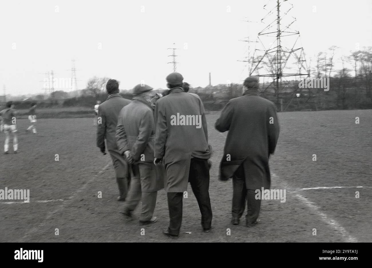 1960s, historical, house masters in their overcoats on the touchline of ...