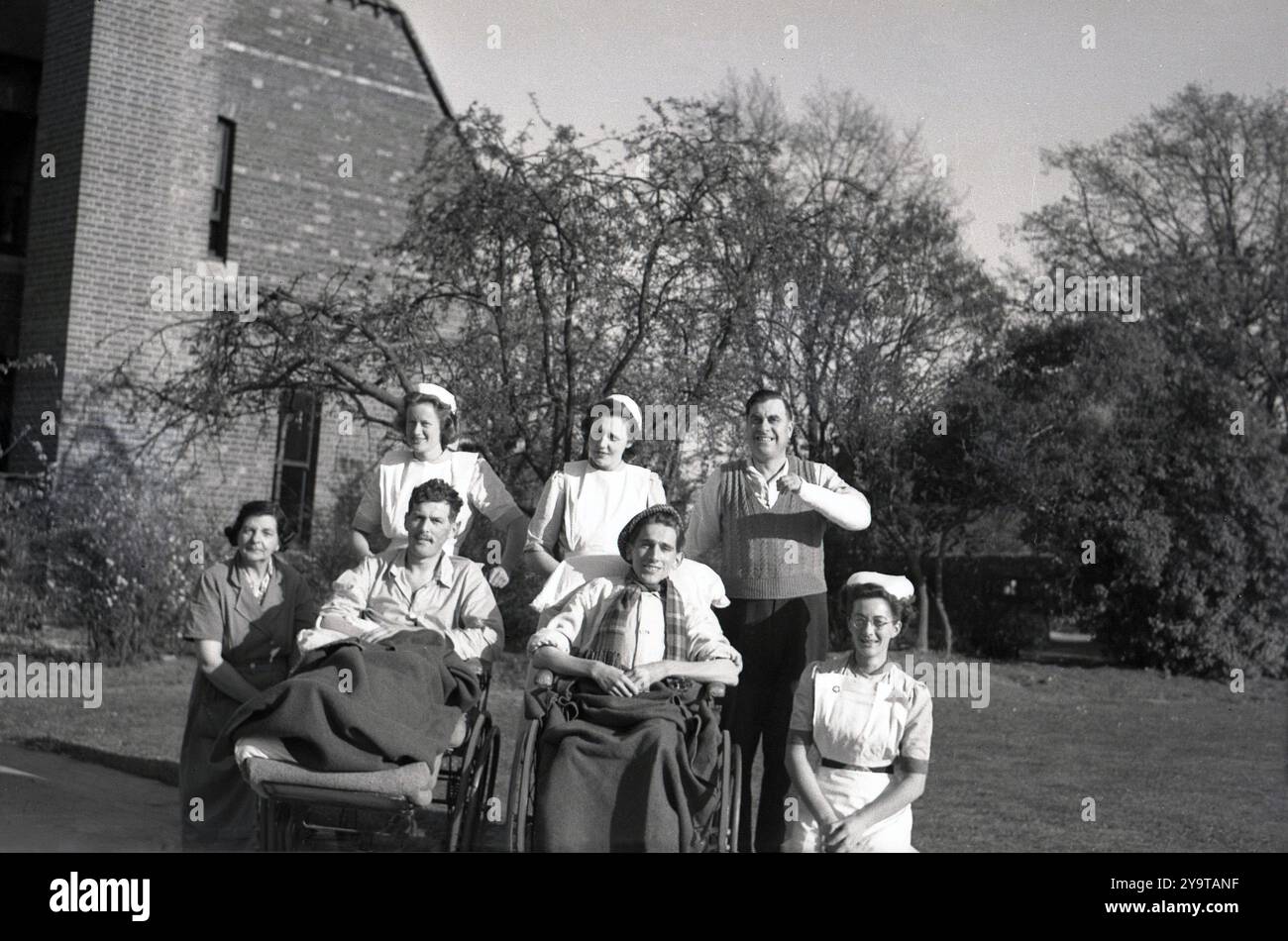1936, historical, nurses, two male patients sitting in hospital ...