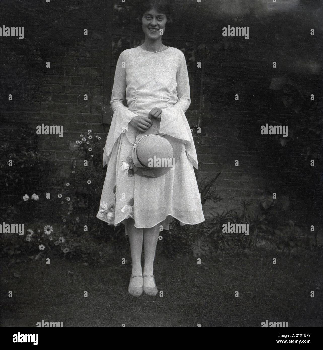 circa 1920s, historical, a young woman, mid twenties in age, dressed in ...