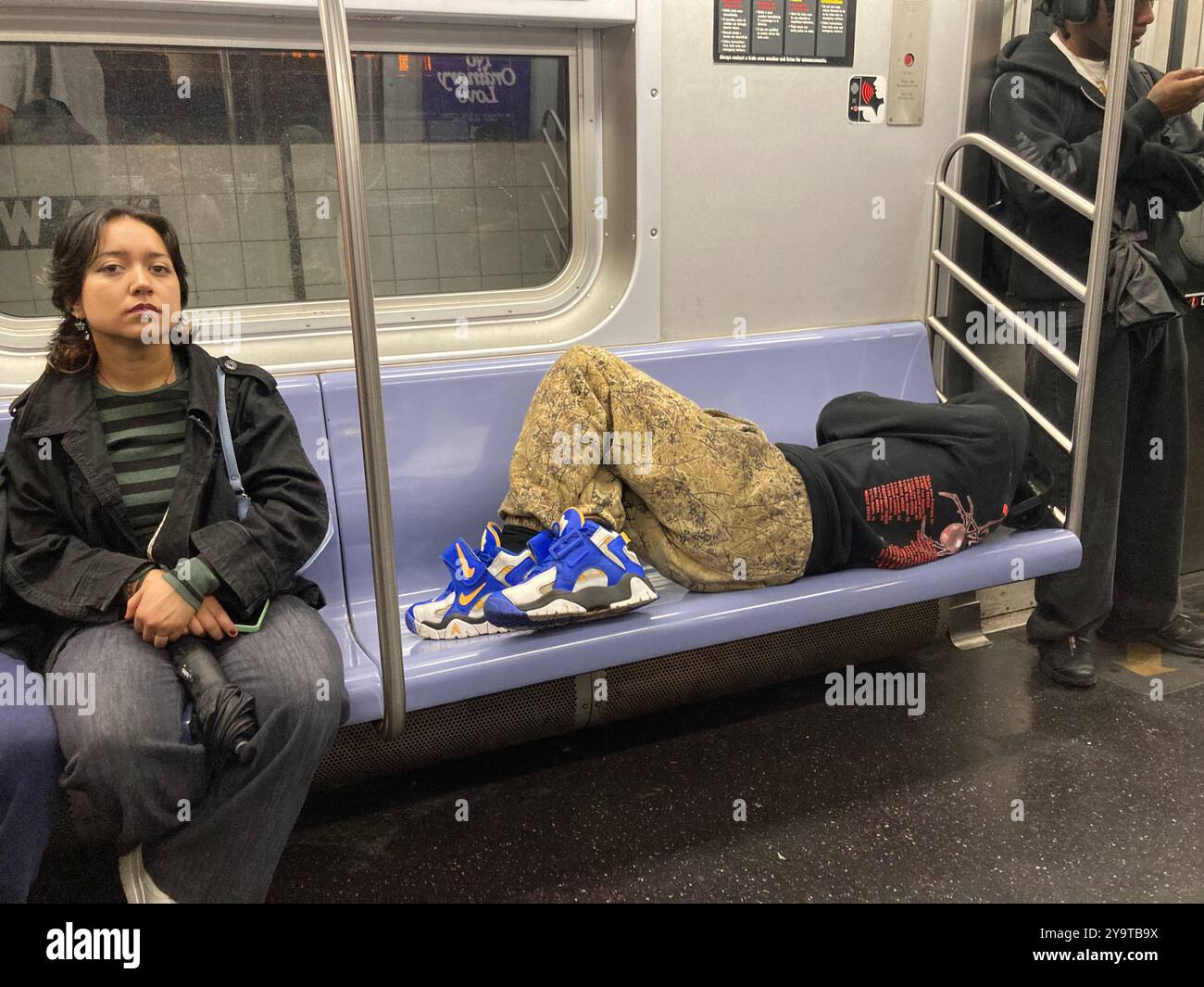 Homeless man asleep in the subway in New York on Saturday, September 28 ...