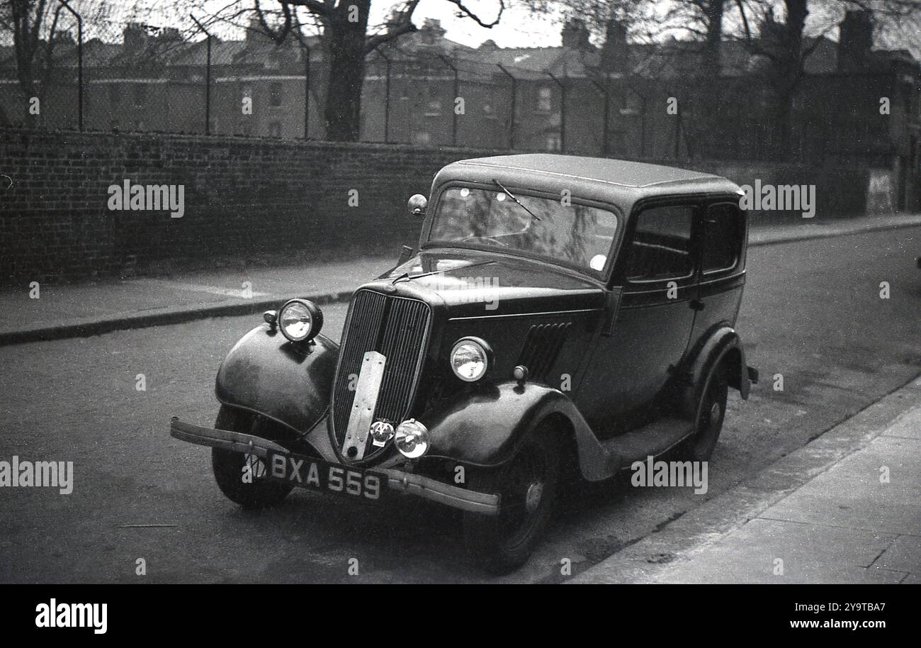1950s, historical, car of the era, parked in a inner city street ...