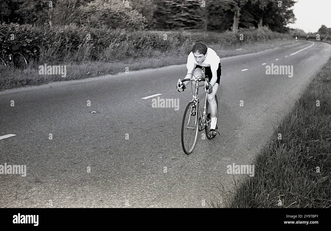 1950s, historical, amateur racing cyclist competing on an open, empty ...