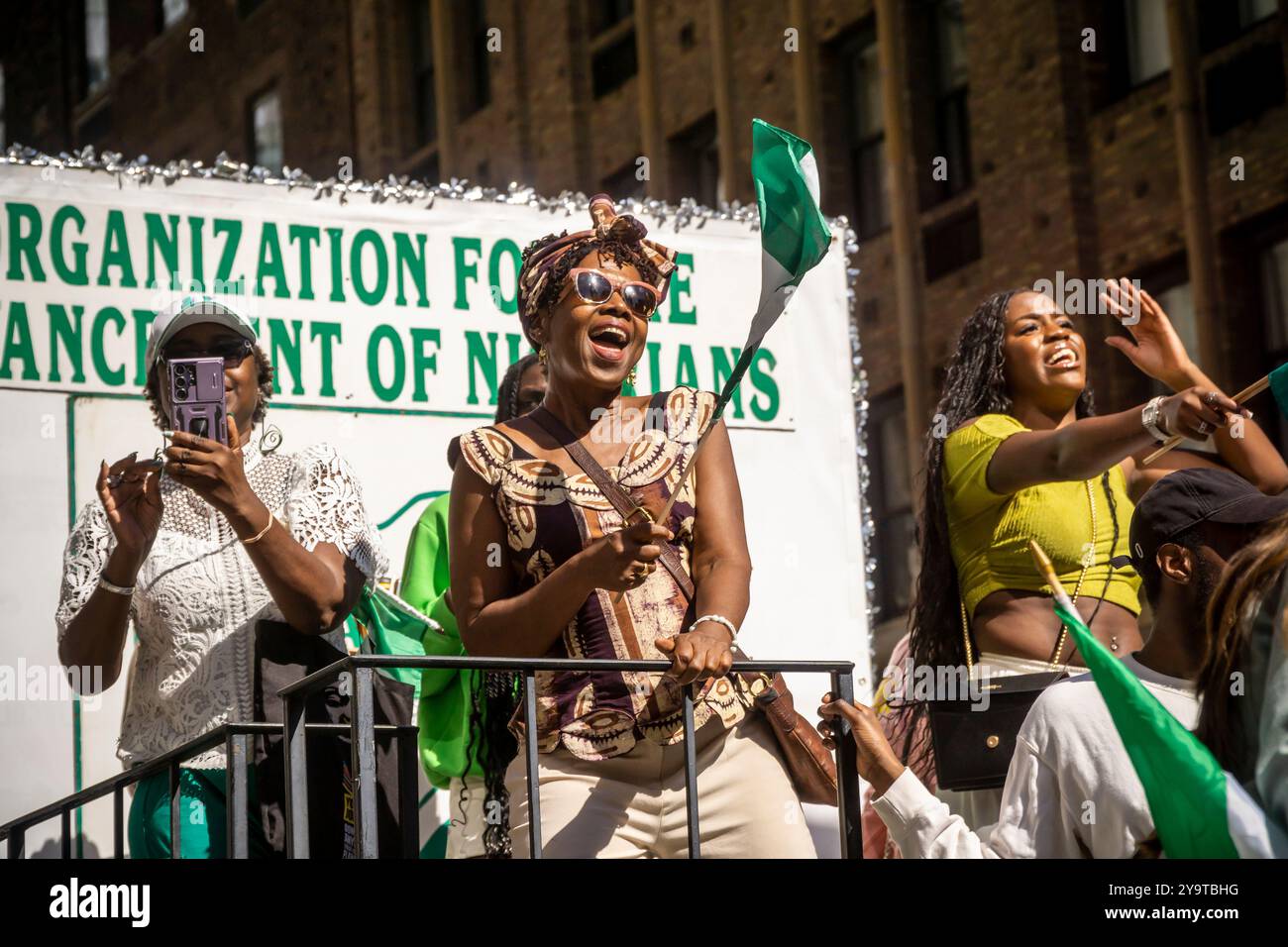 Nigerians living in the New York area, joined by their supporters, celebrate at the Nigerian ...