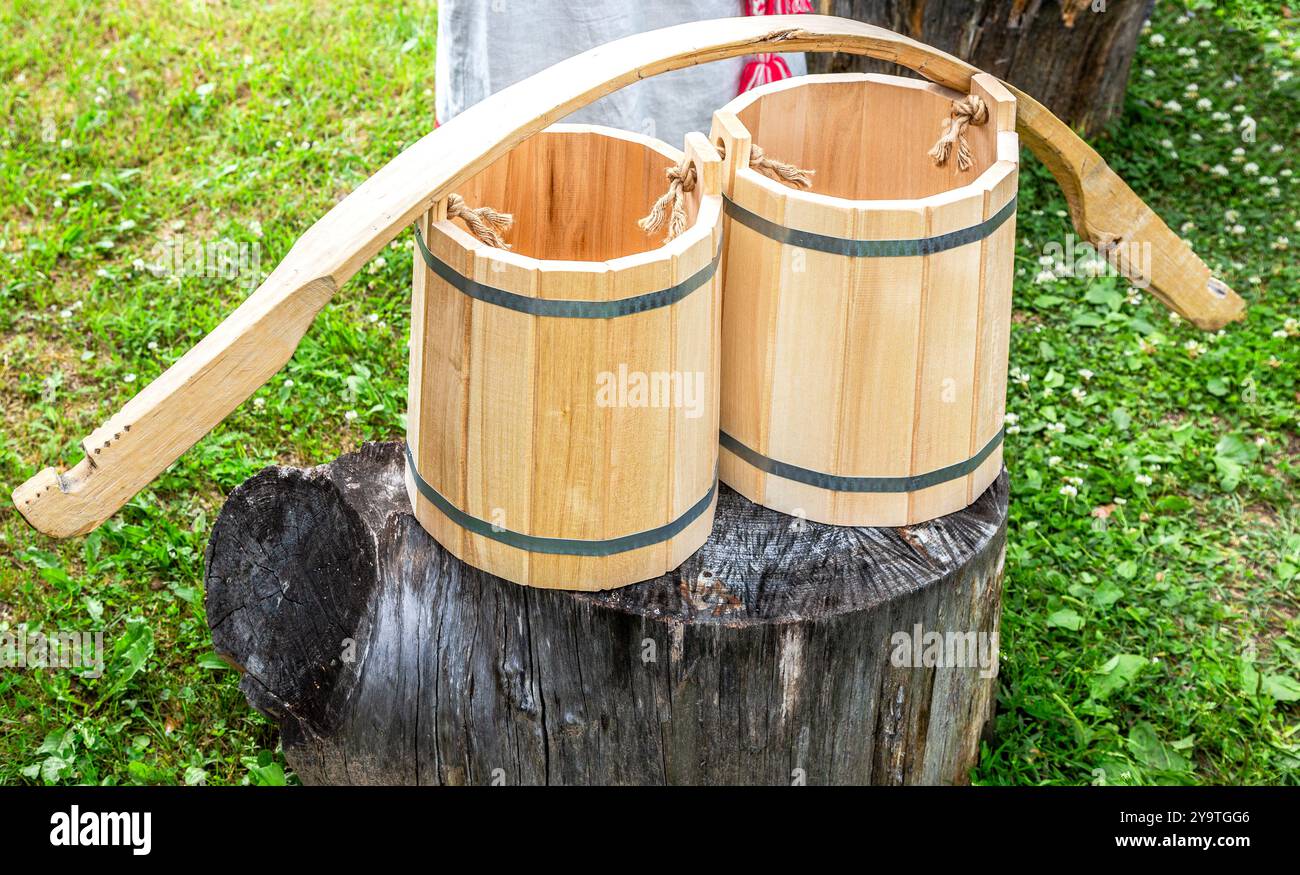 Wooden buckets for water and shoulder yoke for carrying them Stock ...