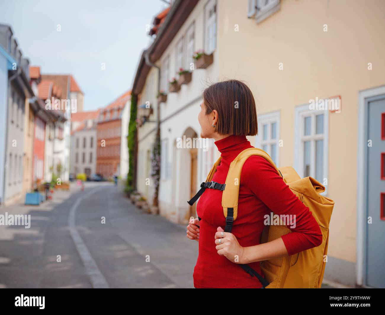 Tourist woman explores beautiful city of Erfurt, wandering through its ...