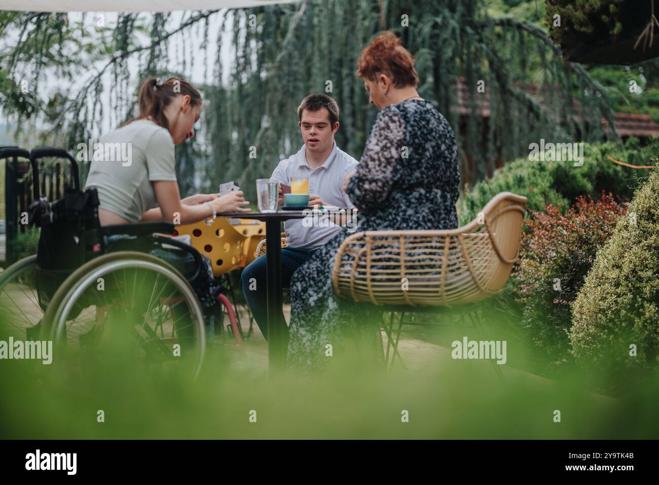 Inclusive outdoor meeting with diverse group in a garden setting Stock ...