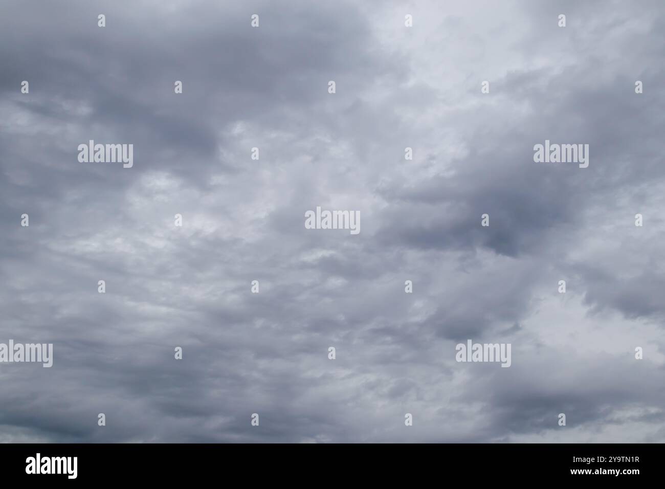 Gray rain clouds loaded with rain in the sky. Overcast sky with dark ...