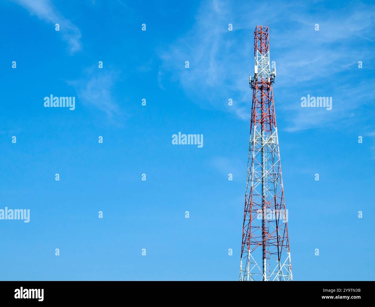 A telecommunications tower with various forms of antennas installed on ...
