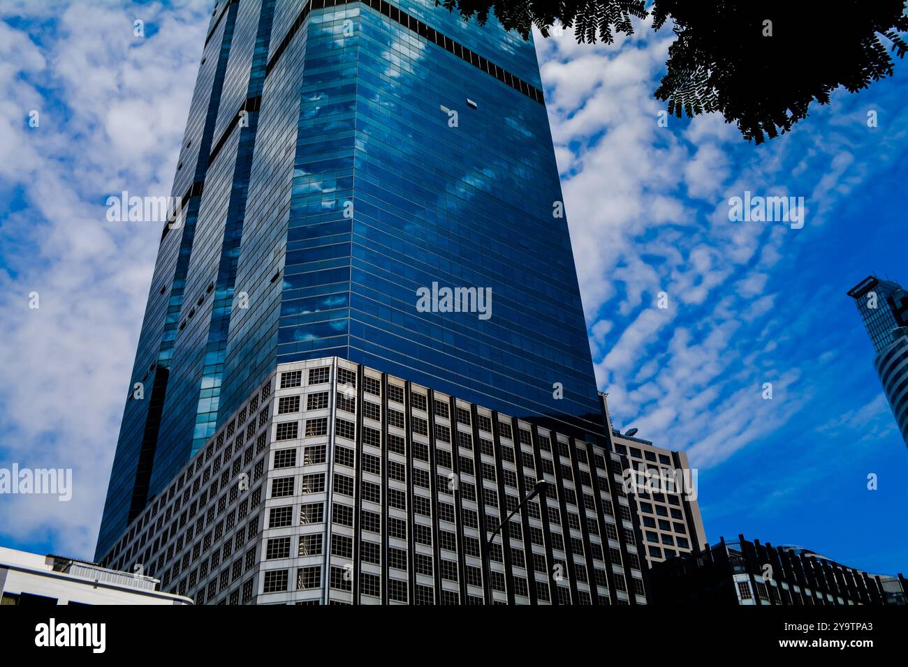 large blue glass building.skyscraper cloud and sky background.Tall ...