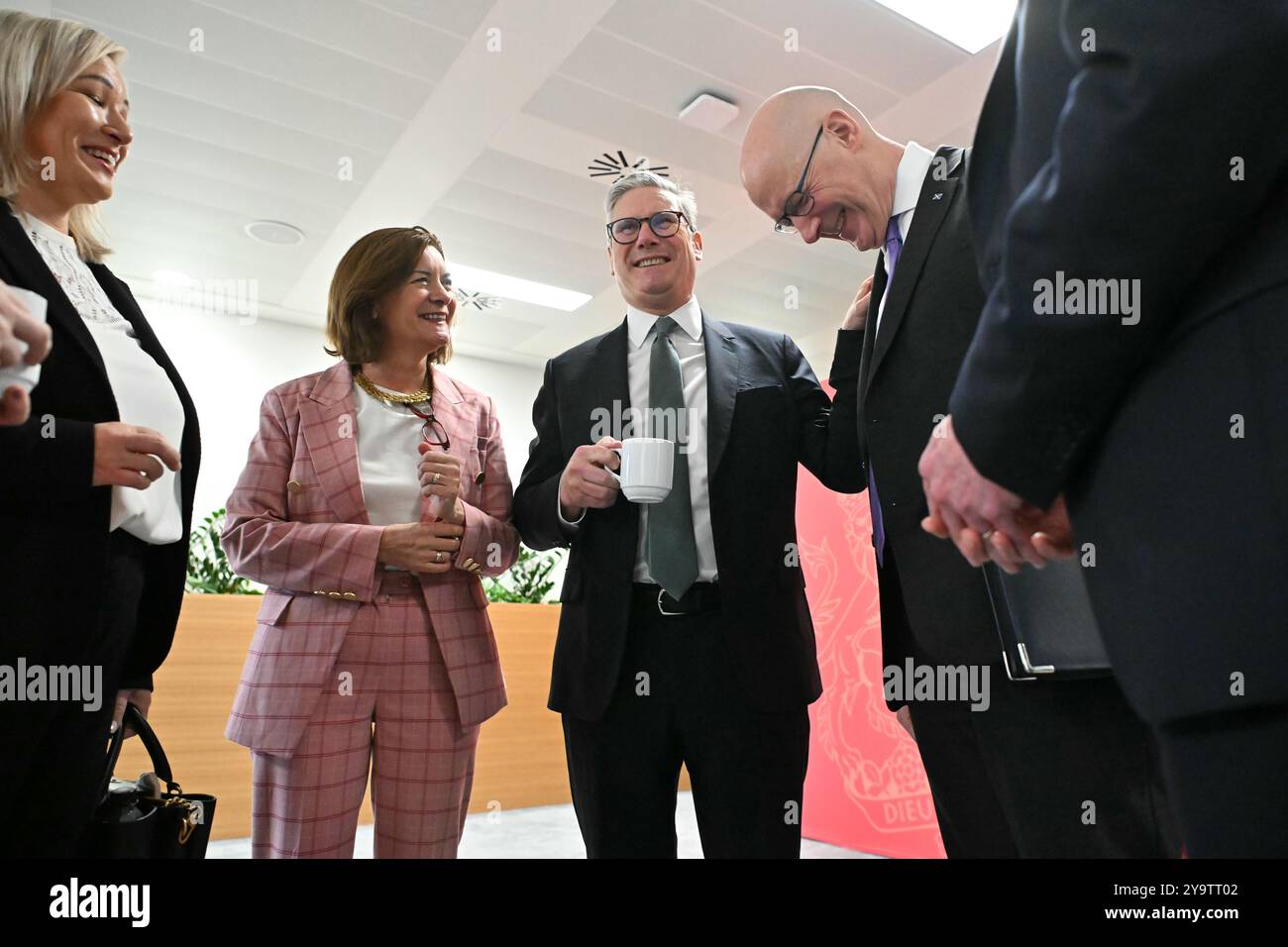 Prime Minister Sir Keir Starmer speaks with (left to right) Northern ...