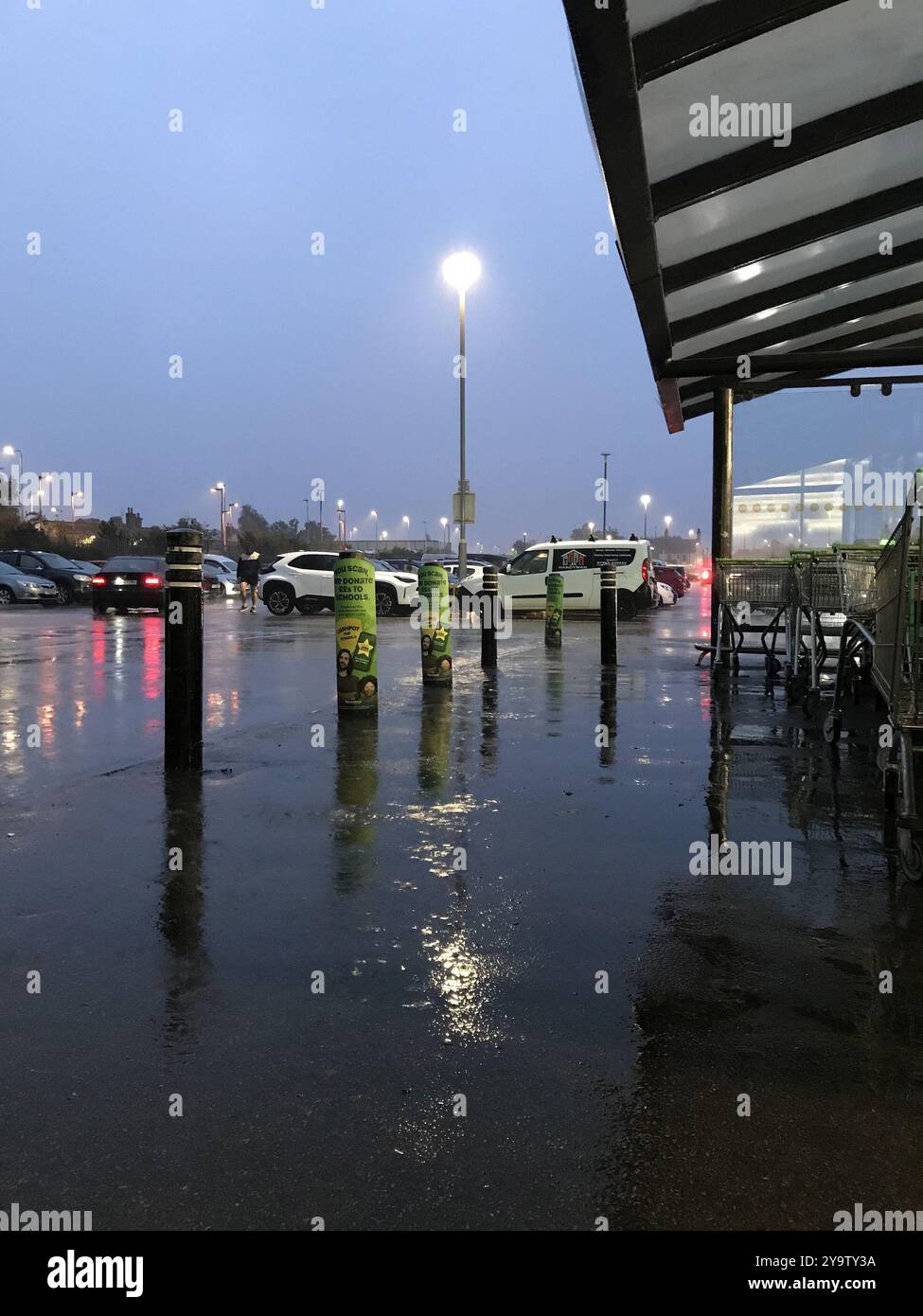 carpark outside ASDA supermarket during a rain storm Stock Photo - Alamy