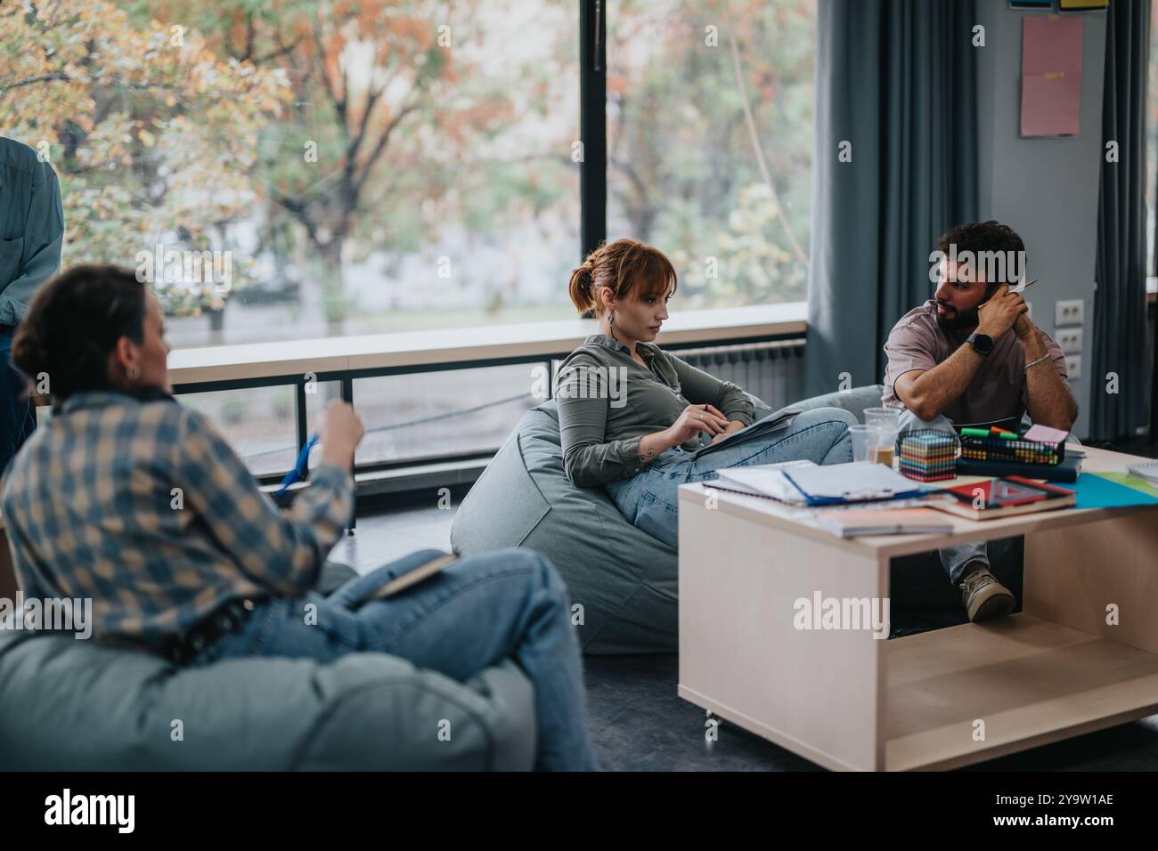 Professor leading a relaxed group discussion with students Stock Photo ...