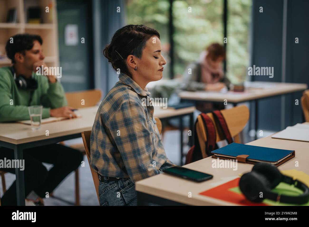 Students attending a cozy classroom with focus and concentration Stock ...