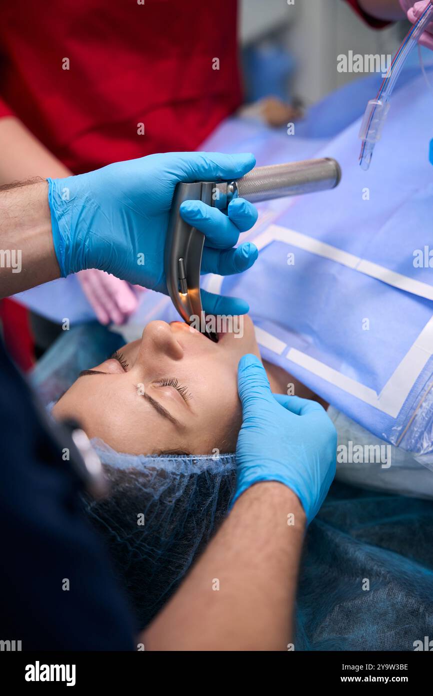 Team of surgeons performs intubation in an operating room Stock Photo ...