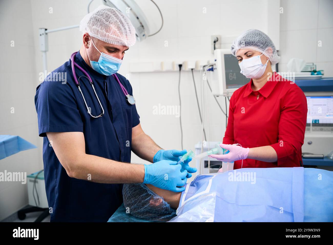 Anesthesiologist works in an operating room with an assistant Stock ...