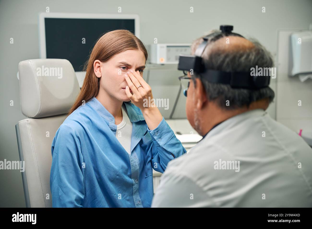 Male patient touching cheek hi-res stock photography and images - Alamy