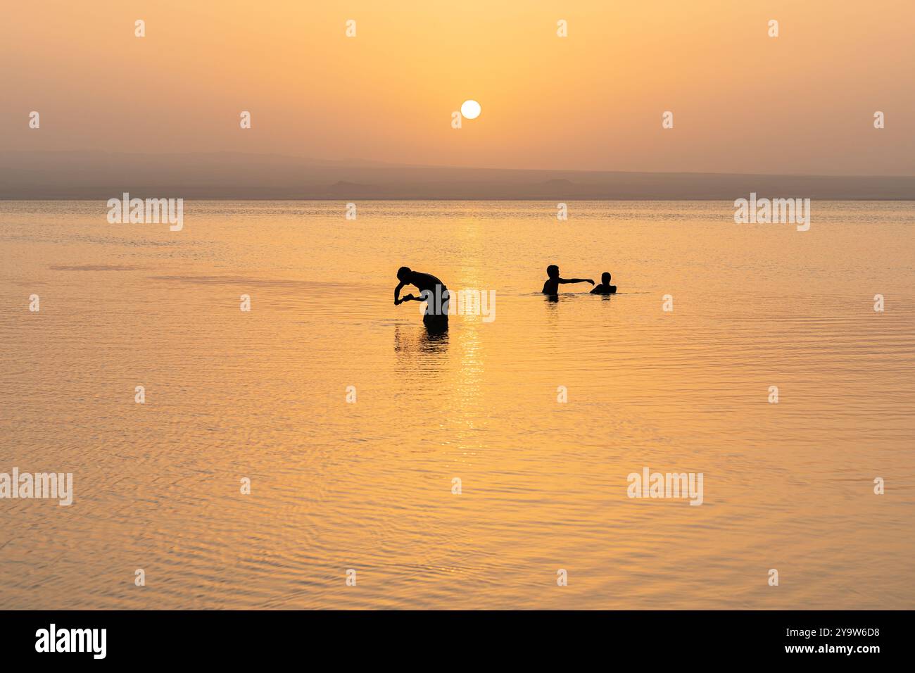 Workers from the salt mining industry washing and swimming in lake ...