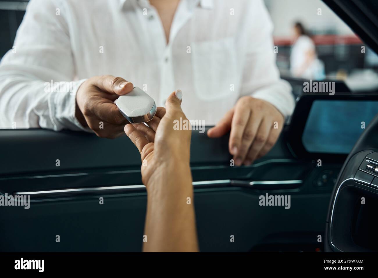 Dealership manager send car keys to the new female owner Stock Photo ...