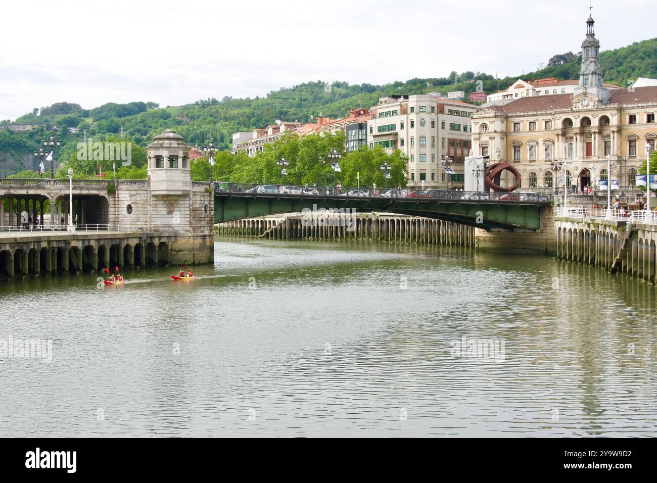 The City Hall Bridge iron drawbridge over the River Nervion with two ...