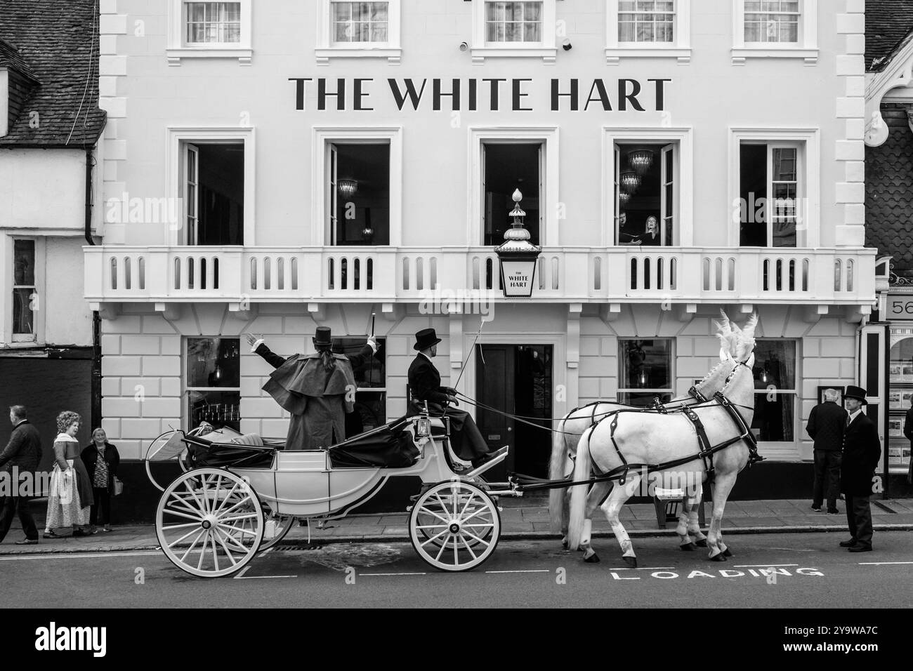 A Traditional Coach and Horses Parked In The High Street Advertises The ...