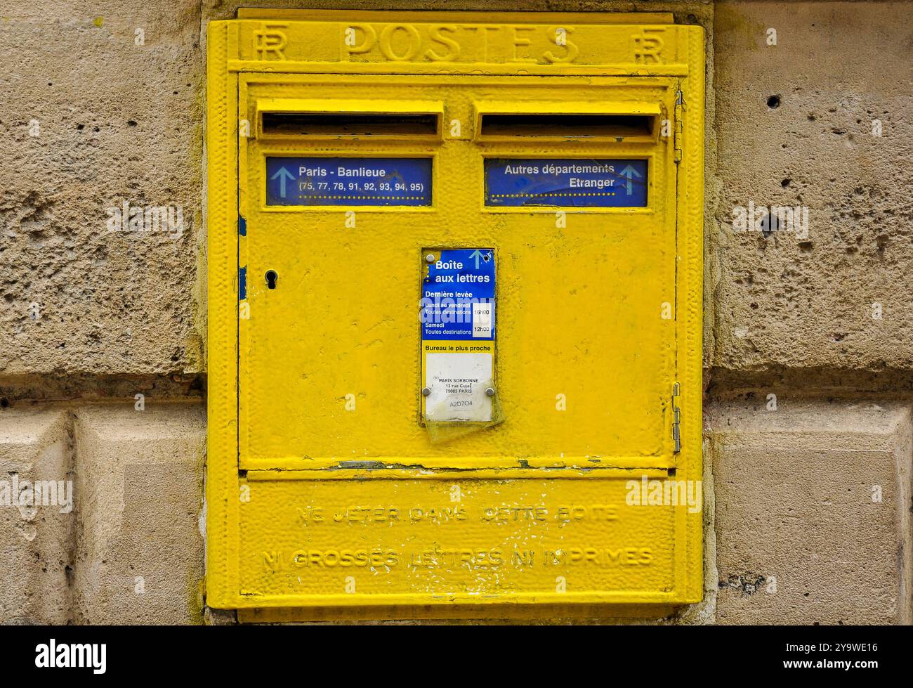French Charm: The Iconic Yellow Mailbox in a curbside of Paris Stock ...
