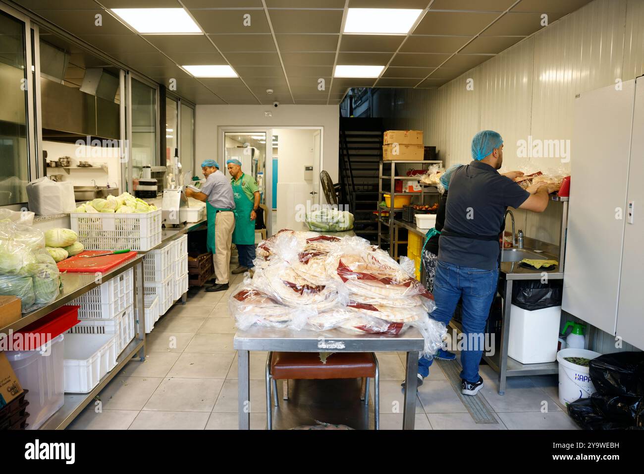 Lebanon. 11th Oct, 2024. People gather to prepare meals for immigrants ...