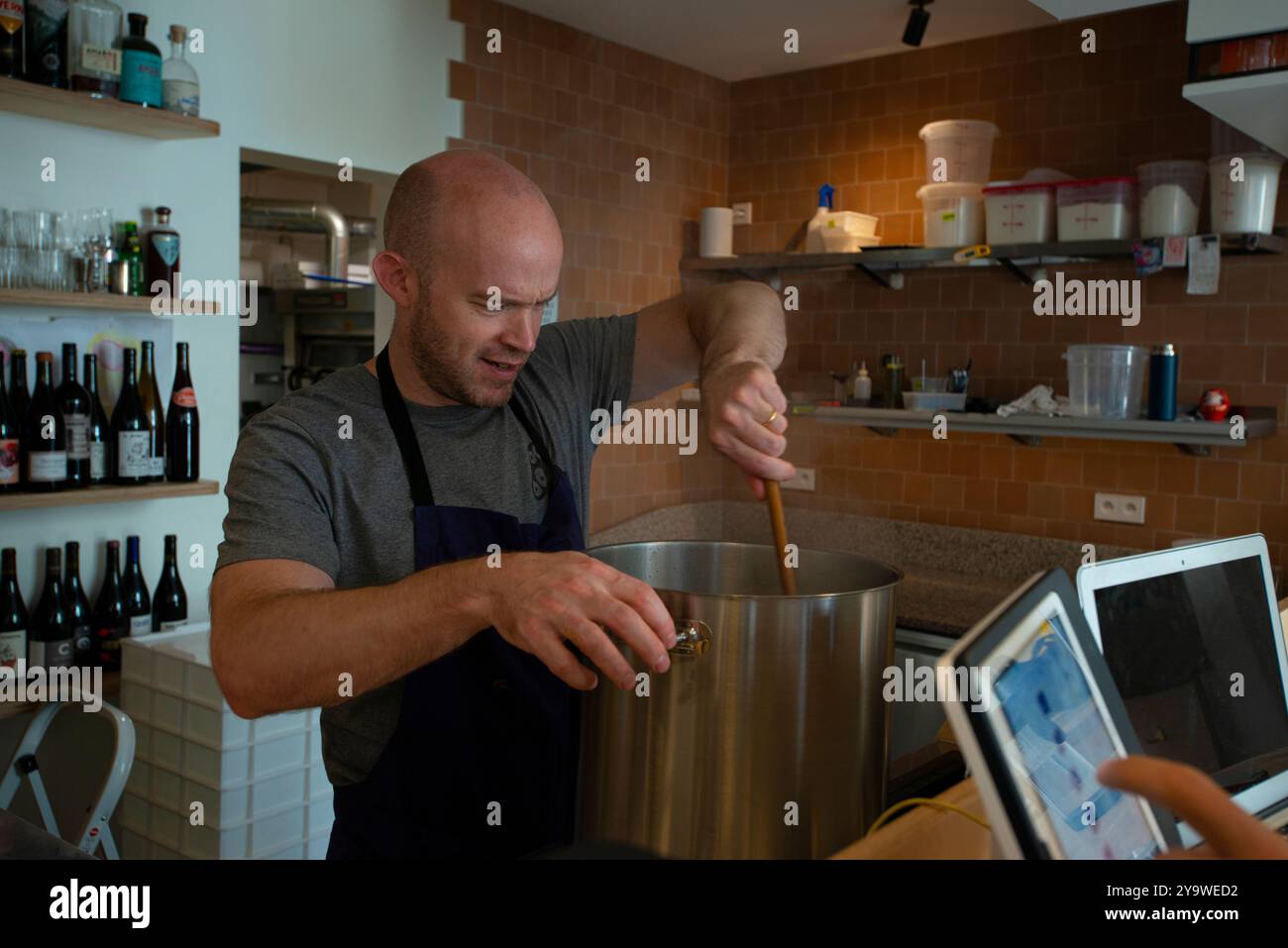 Daniel Pearson, founder of the Oobatz restaurant in Paris, preparing ...