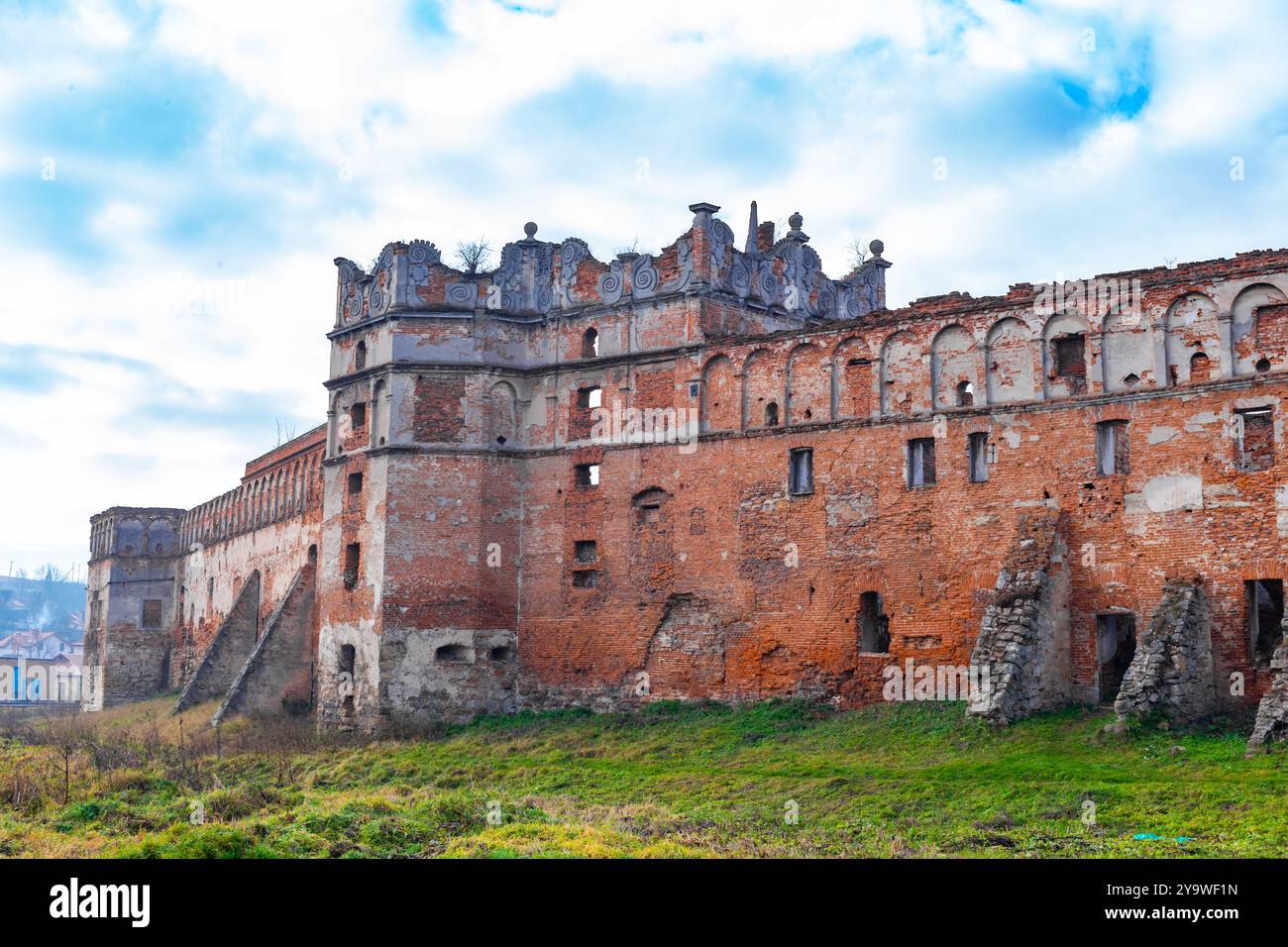 The old ruins of the collapsed walls with gates and windows ...