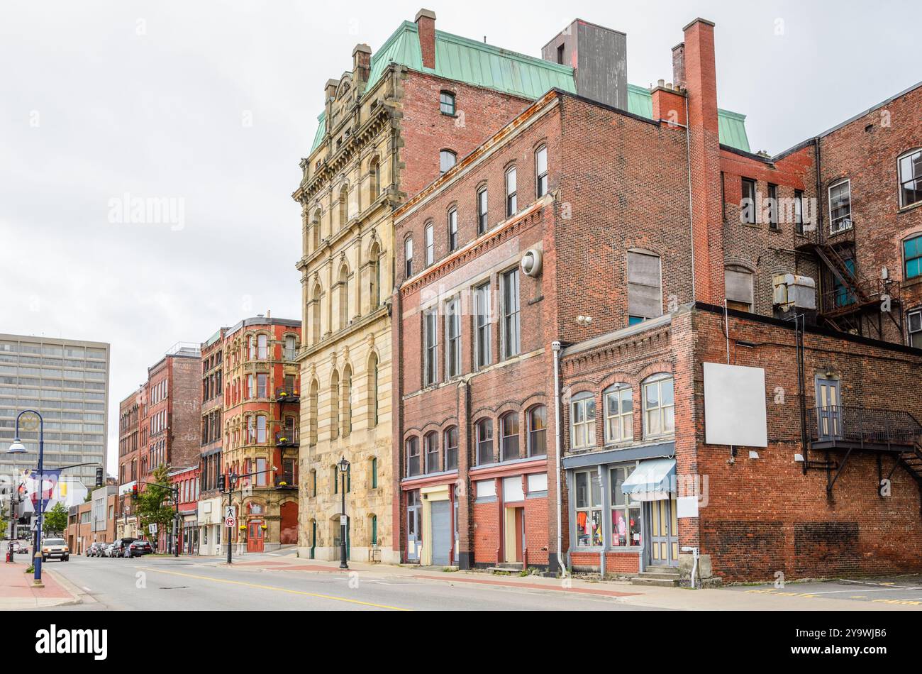 Traditional American brick buildings with shops on ground level along a ...