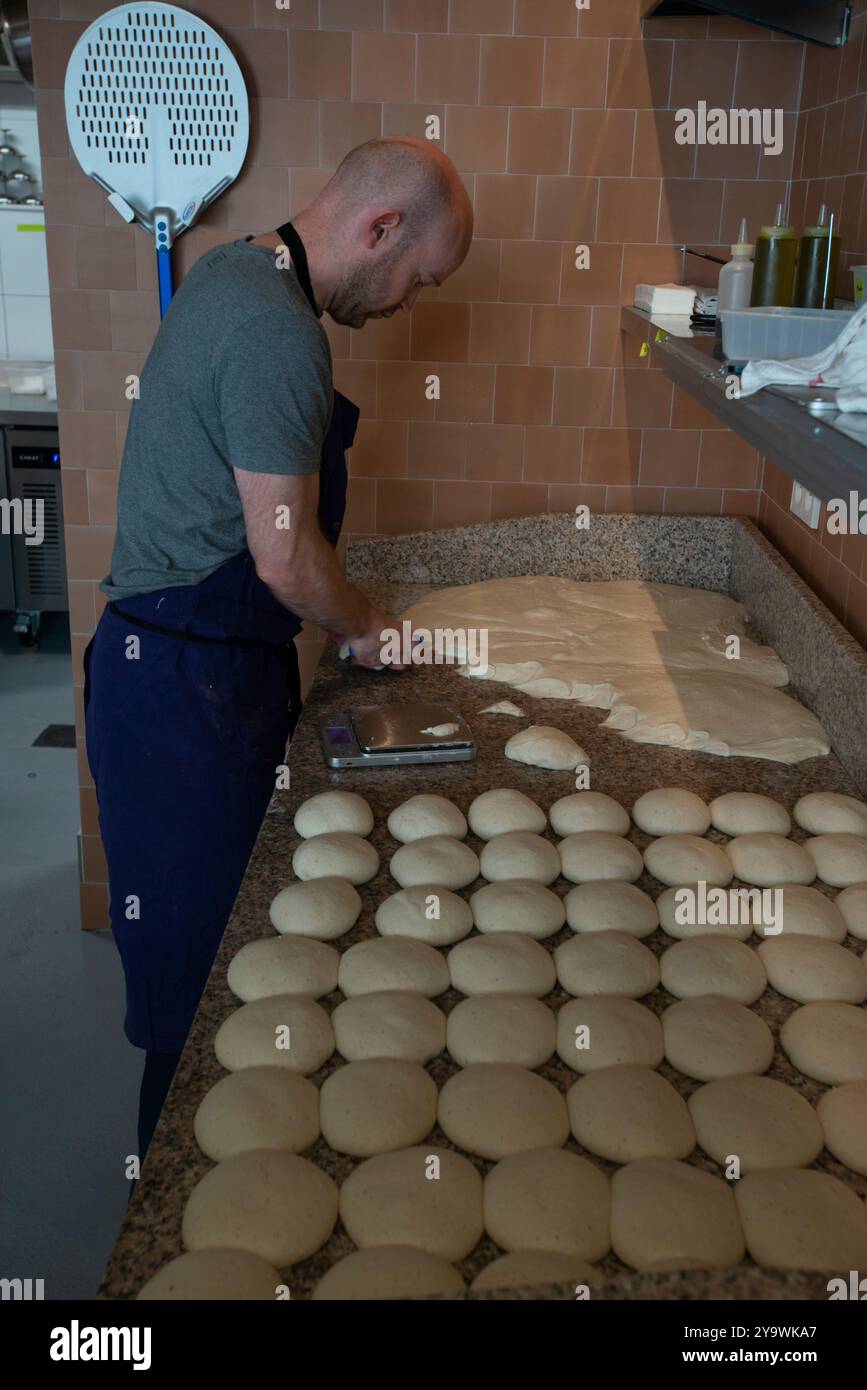 Daniel Pearson, founder of the Oobatz restaurant in Paris, working on ...
