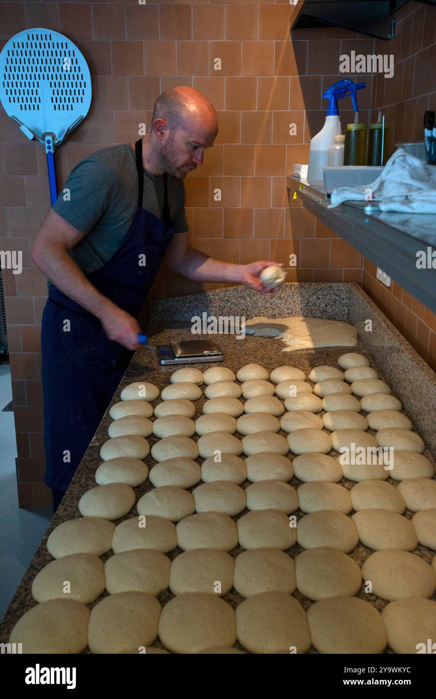 Daniel Pearson, founder of the Oobatz restaurant in Paris, working on ...