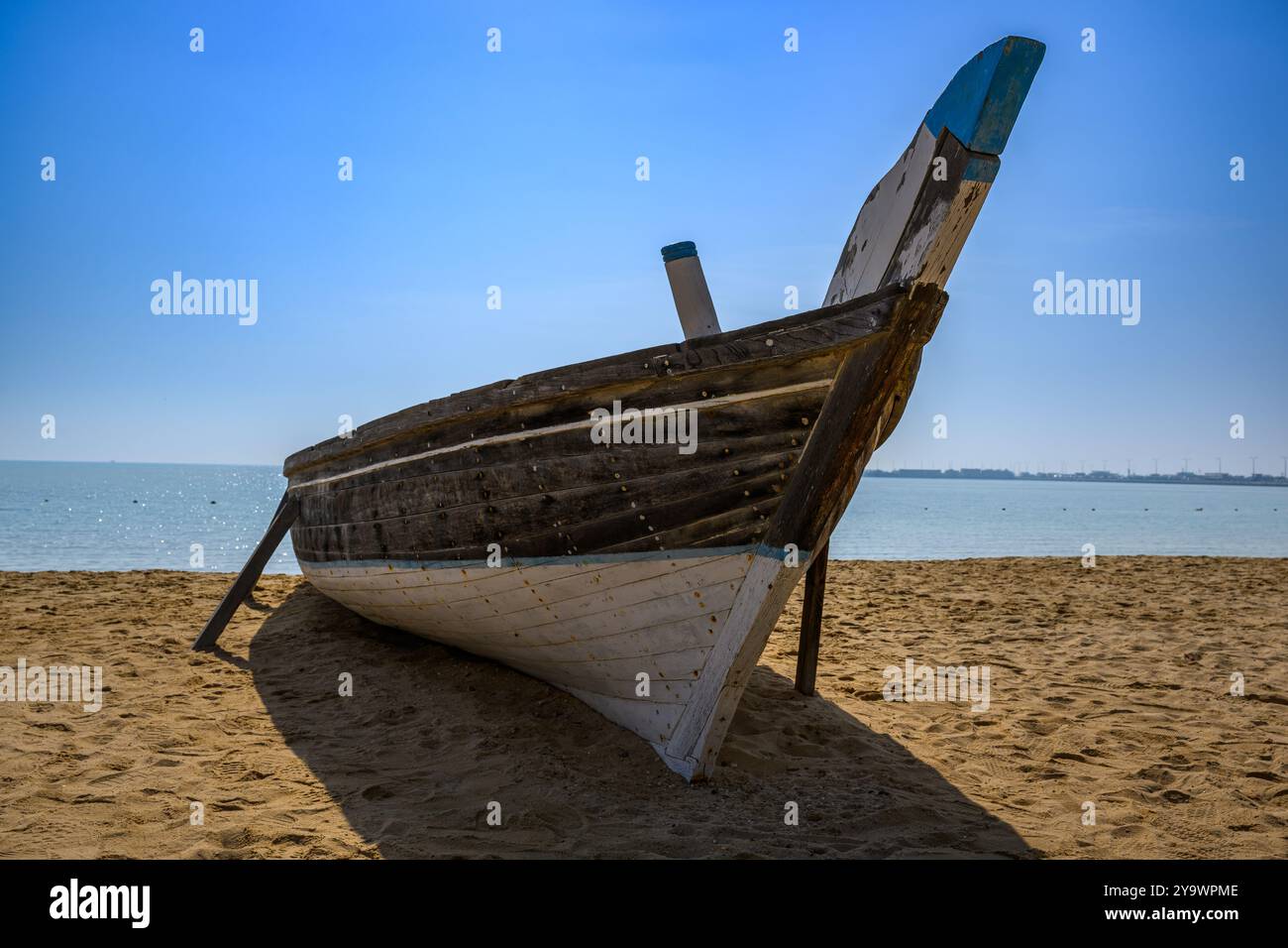Old boat on the sand in Al Wakra Beach Qatar with sea background Stock ...