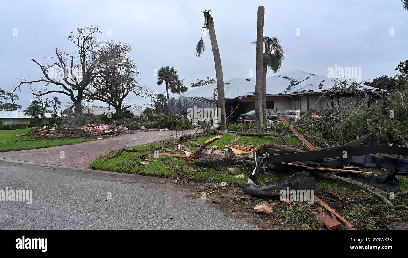 Stuart, United States. 10th Oct, 2024. Damaged homes and downed trees ...