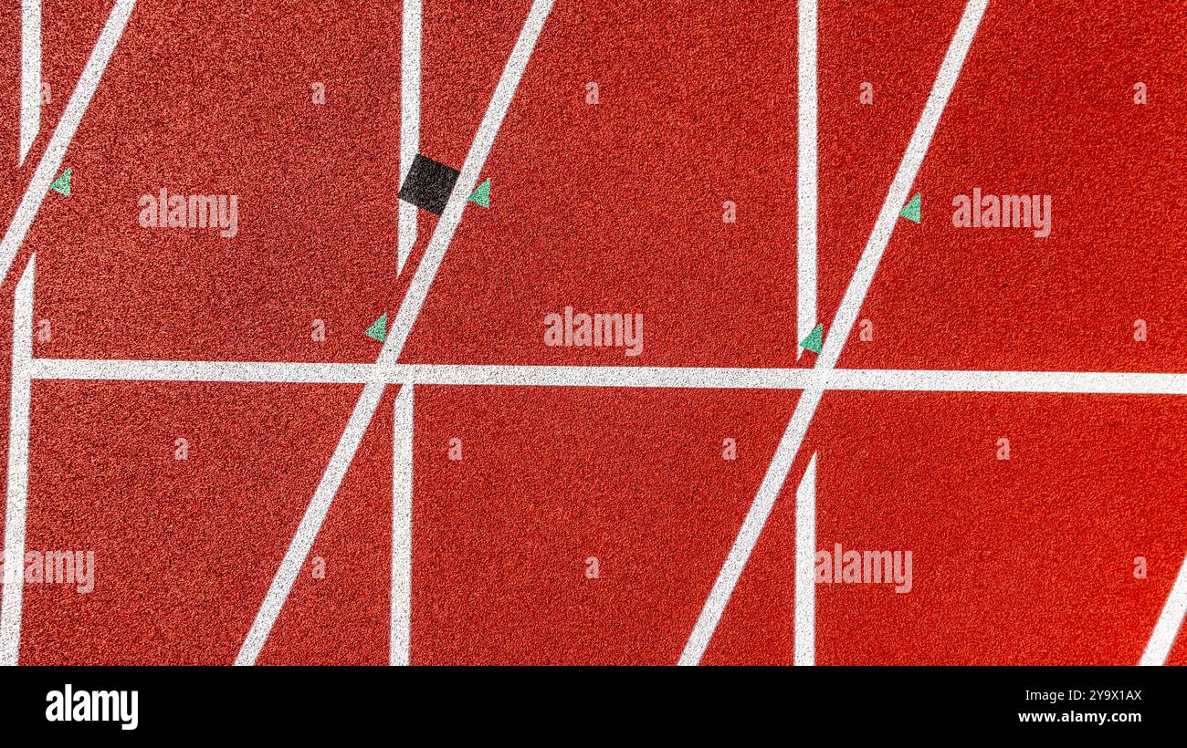 Aerial image of a new red running track with white lane lines and other ...