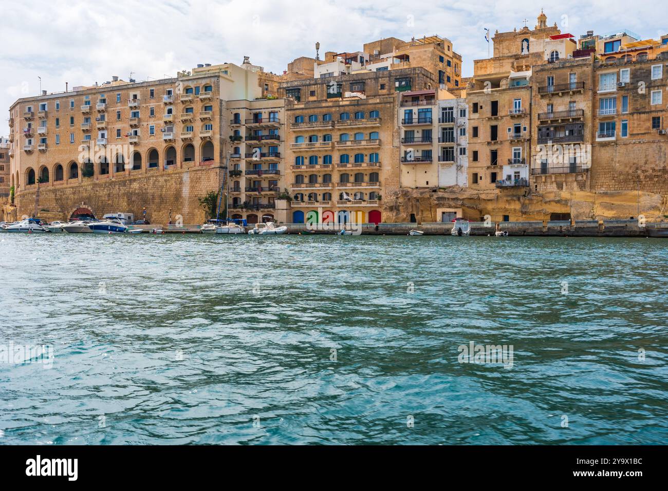 Traditional Maltese buildings with colourful balconies in historic old ...