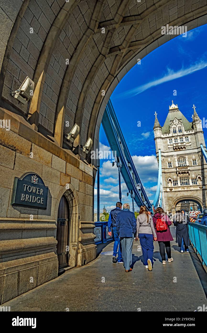 Pedestrians crossing Tower Bridge, London. UK Stock Photo - Alamy