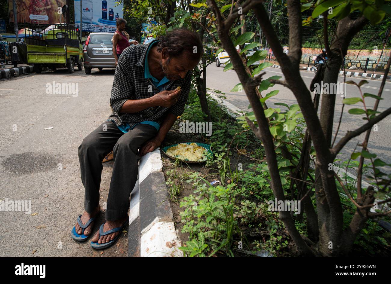 October 11, 2024: Homeless people eats food being distributed by ...