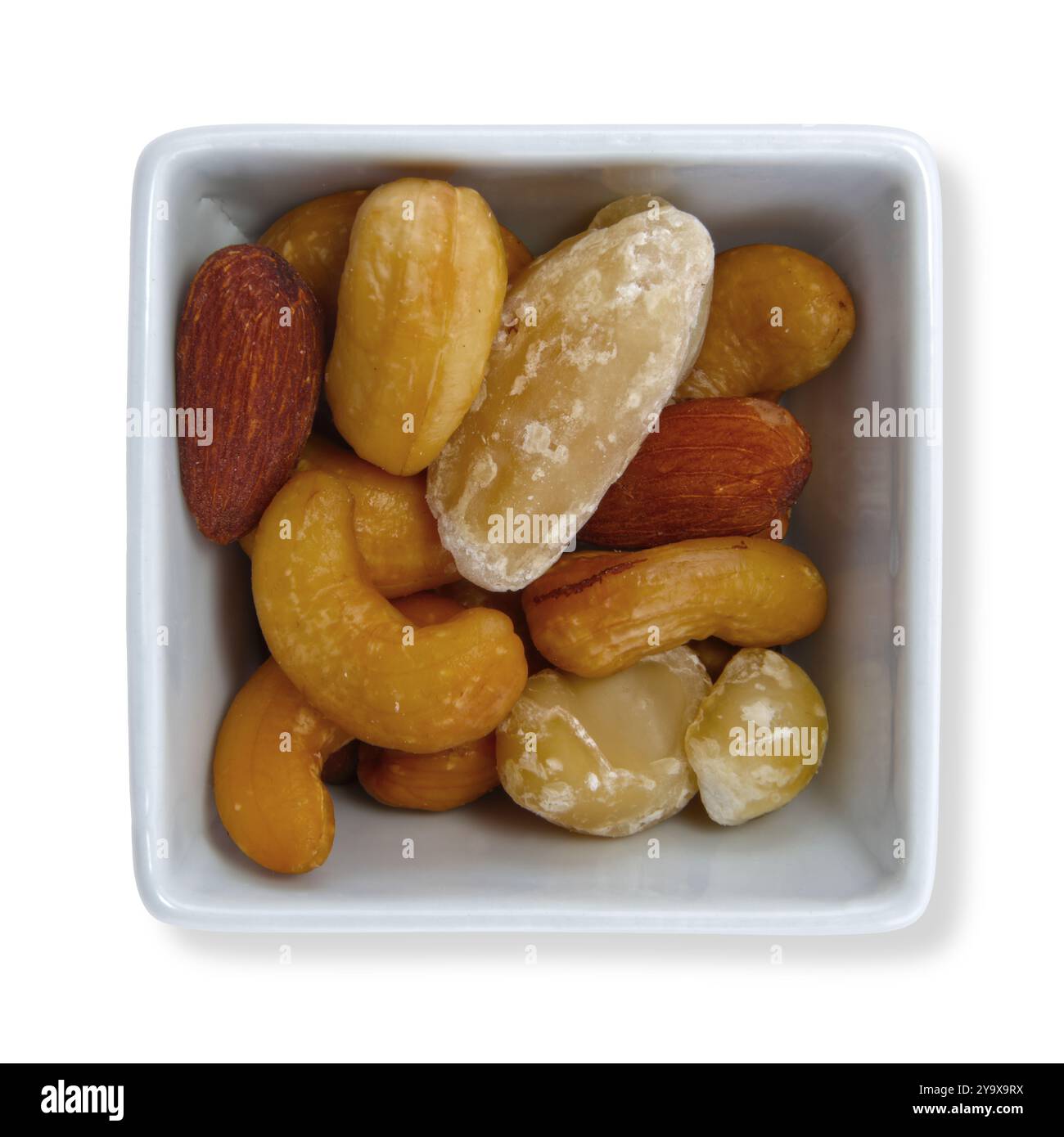 Mixed nuts in white container Stock Photo - Alamy