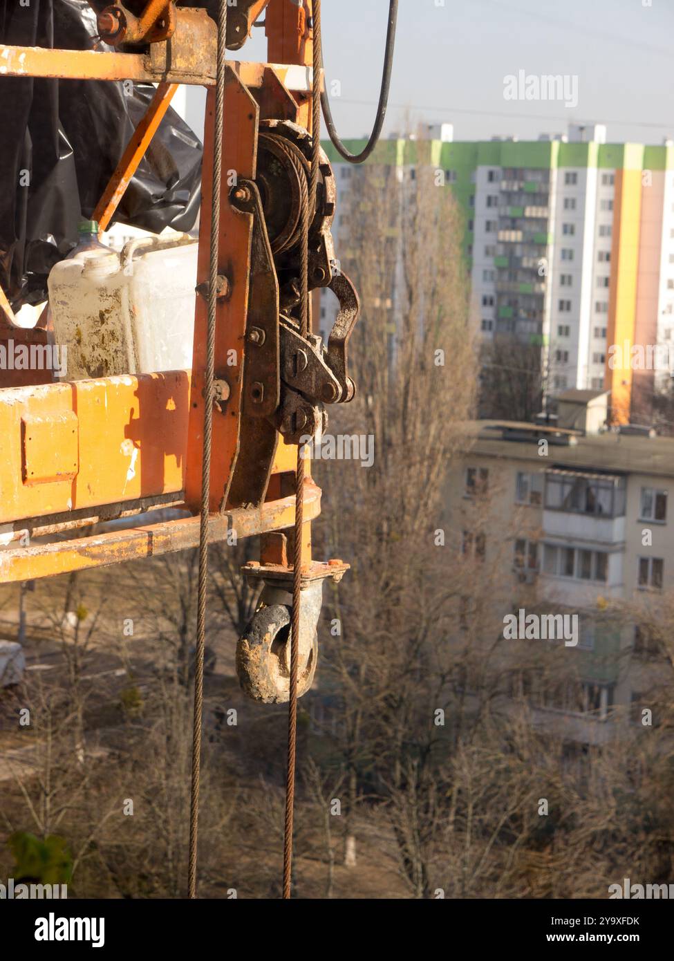 The Orange Crane cradle platform Stock Photo - Alamy