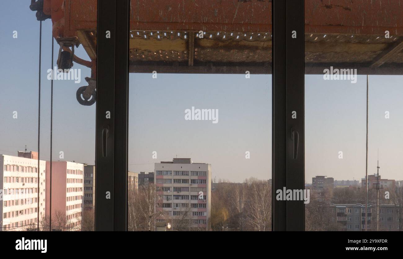 The Orange Crane cradle platform Stock Photo - Alamy