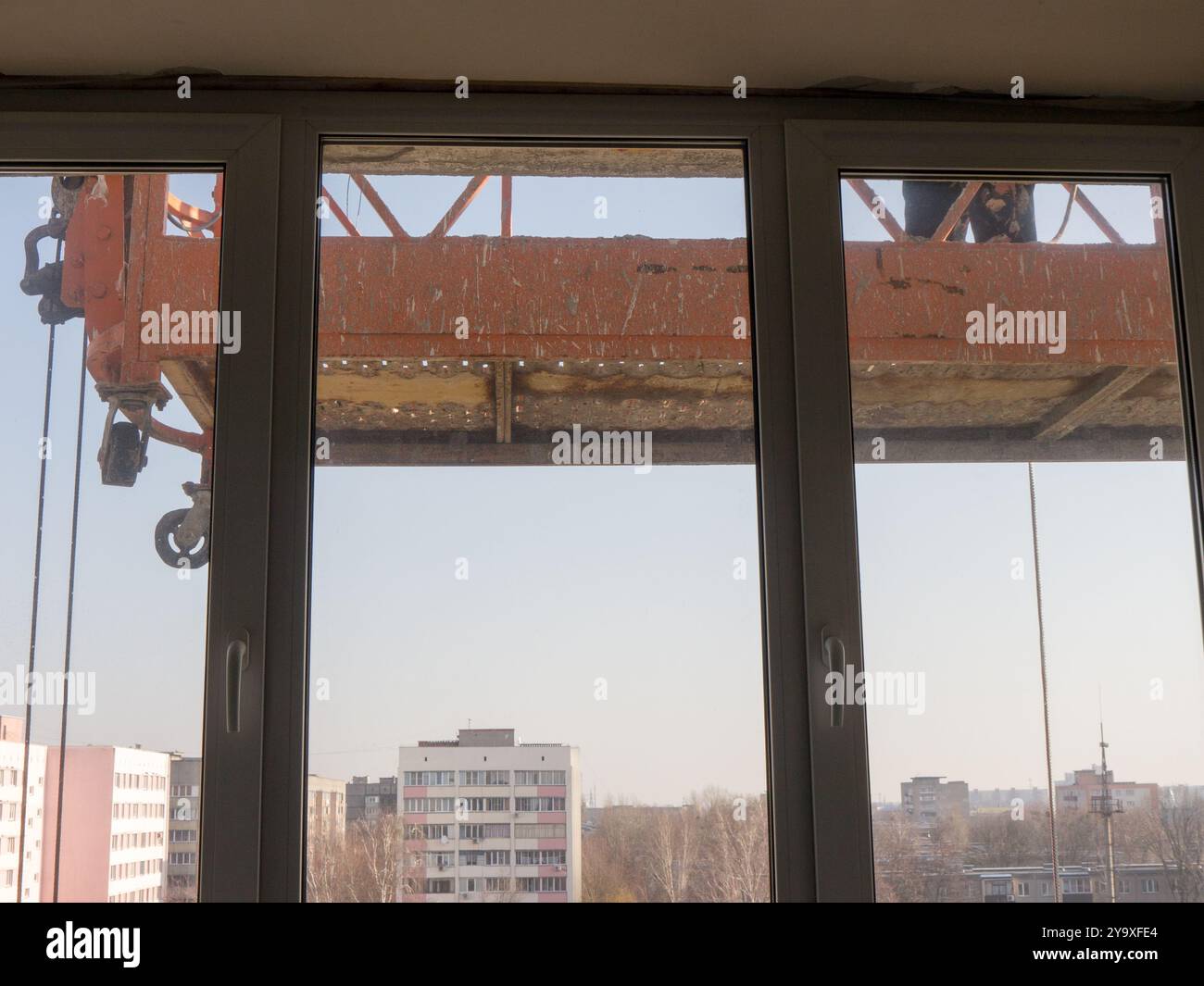 The Orange Crane cradle platform Stock Photo - Alamy