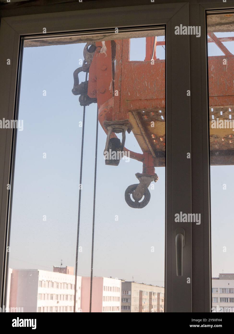 The Orange Crane cradle platform Stock Photo - Alamy