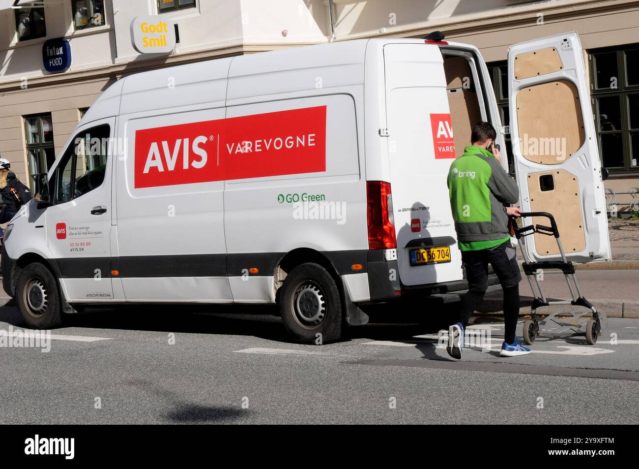 Copenhagen/ DenmarK/11 October 2024/Avis goods delivery van and male in ...