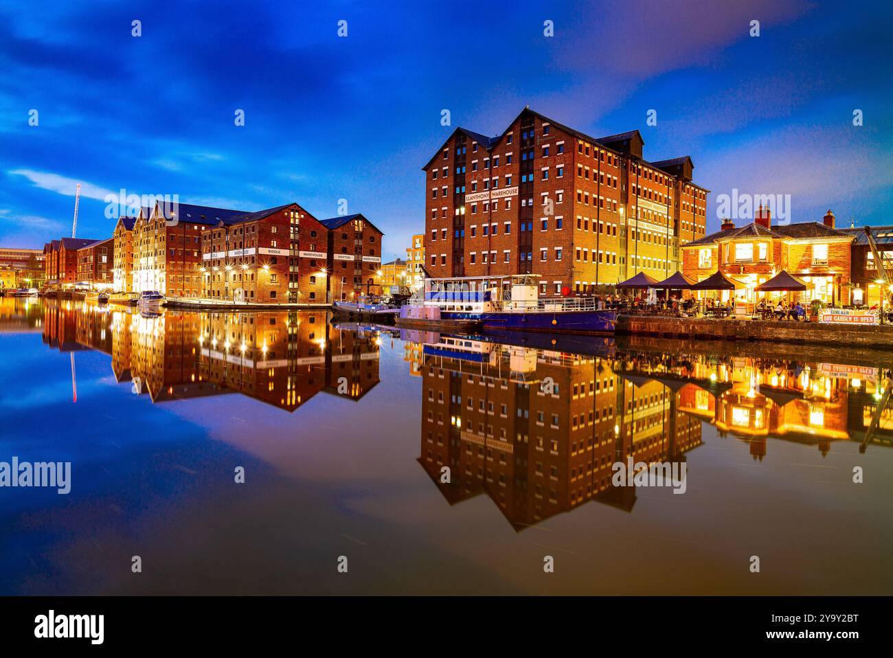 Gloucester docks at night with reflections on the water Stock Photo - Alamy