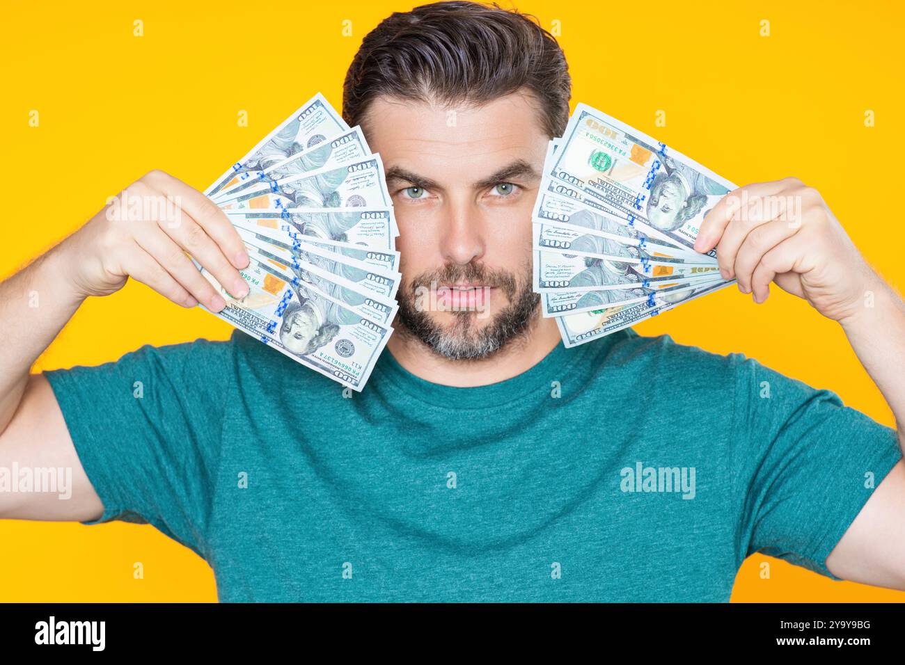 Money cash, dollar banknotes concept. Portrait of man holding bunch of ...
